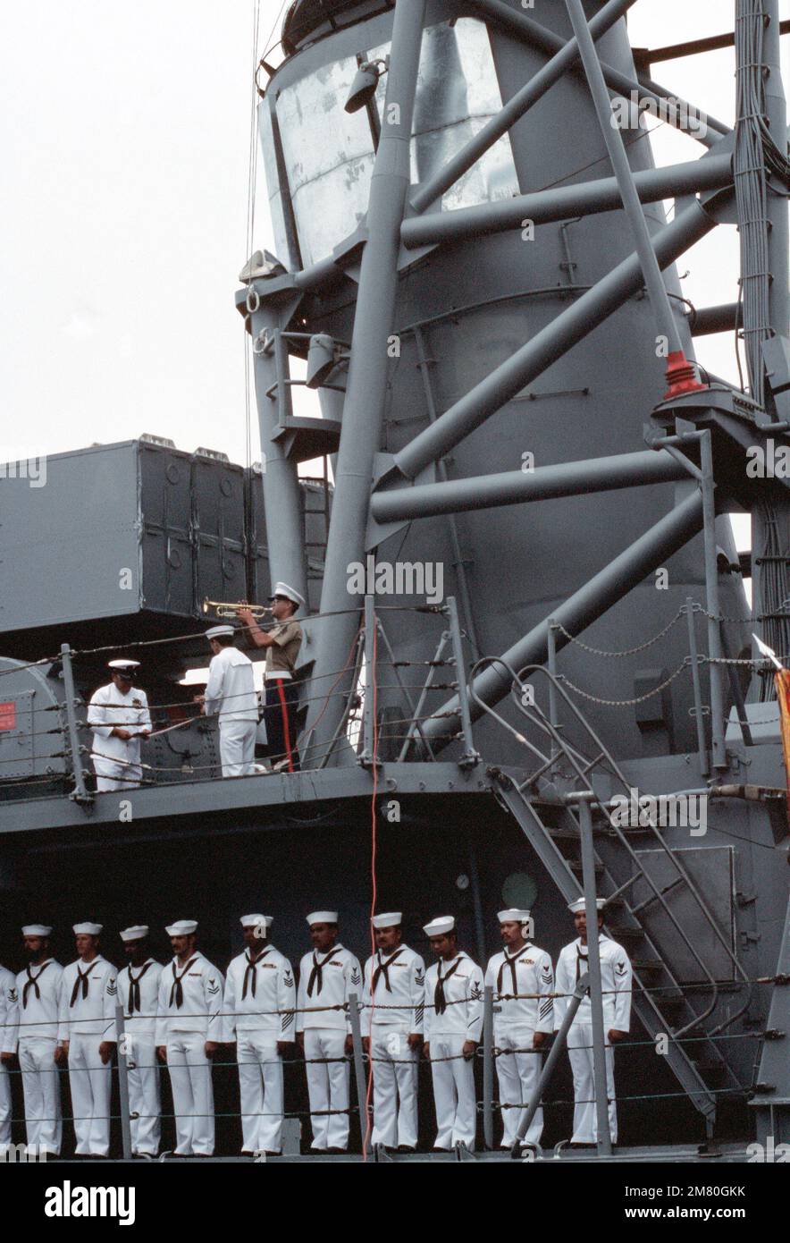A Marine bugler plays during the decommissioning ceremony for the ...