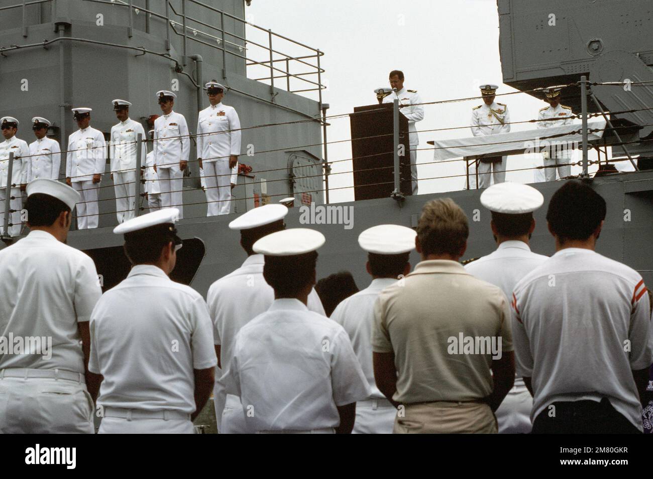 A Navy chaplain says a prayer during the decommissioning ceremony for ...