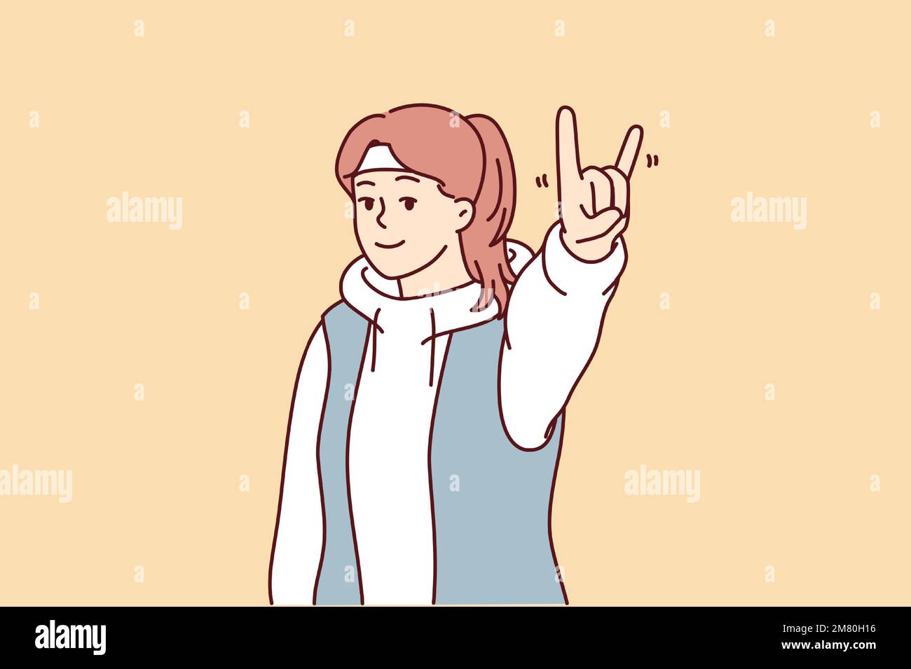 Young woman showing goat gesture demonstrating love for rock and roll ...