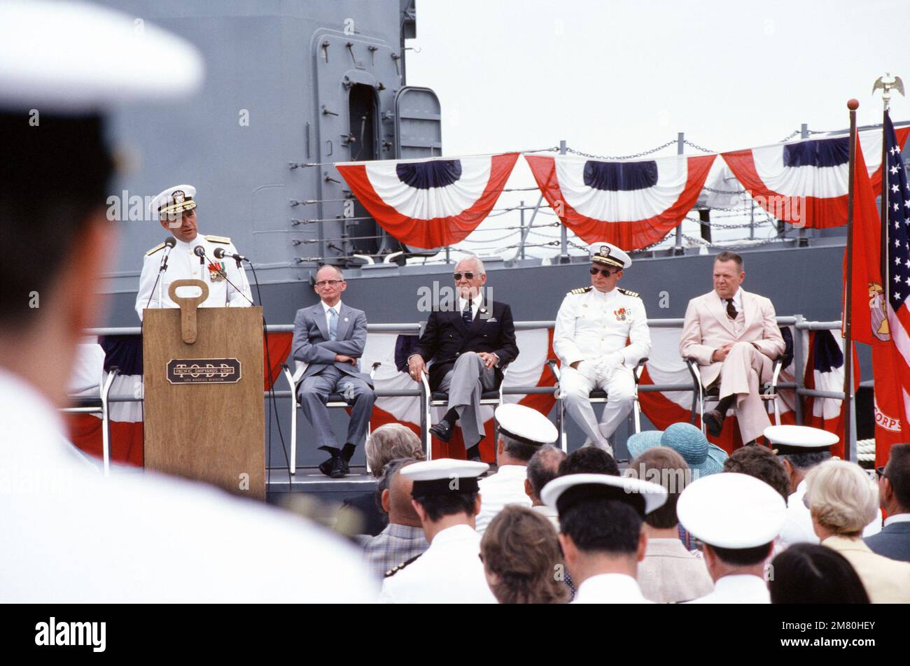 A guest speaker addresses the spectators attending the commissioning ...