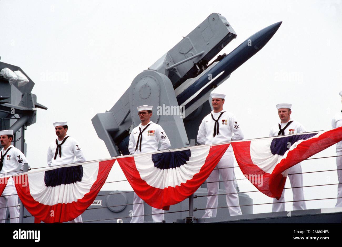 Crewmen line the deck of the guided missile frigate USS JARRETT (FFG 33 ...