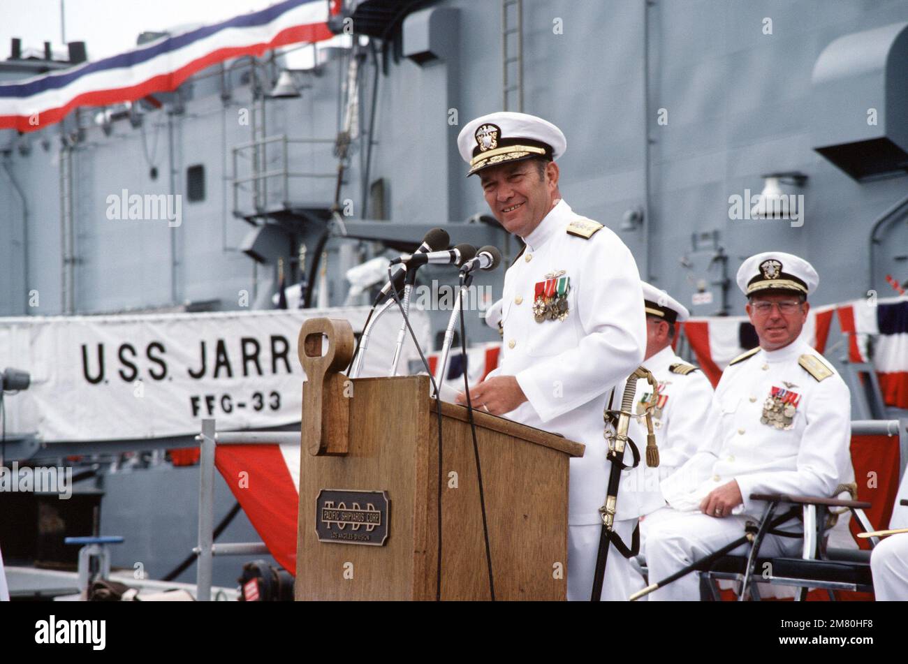 A guest speaker addresses the spectators attending the commissioning ...