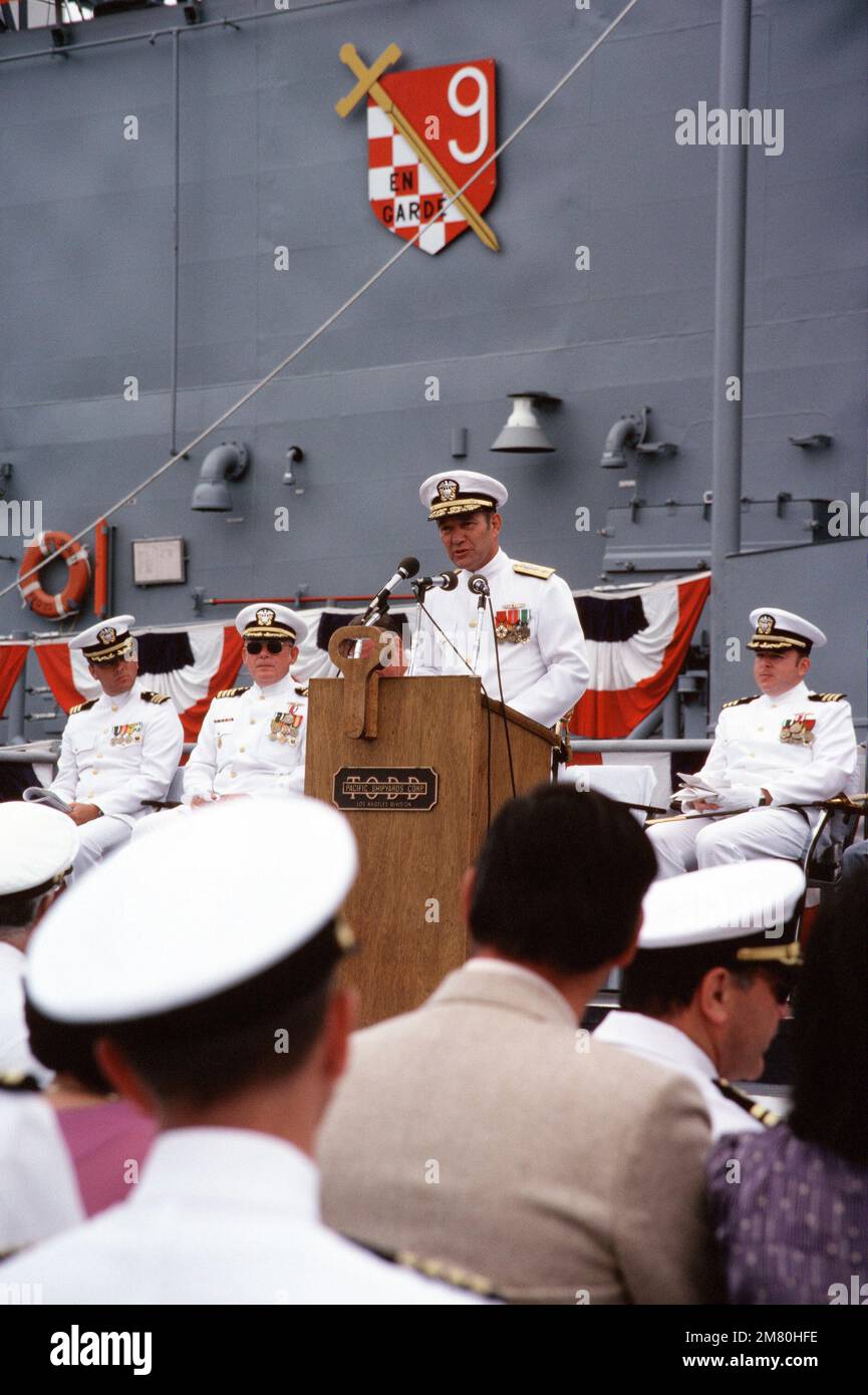 A guest speaker addresses the spectators attending the commissioning ...