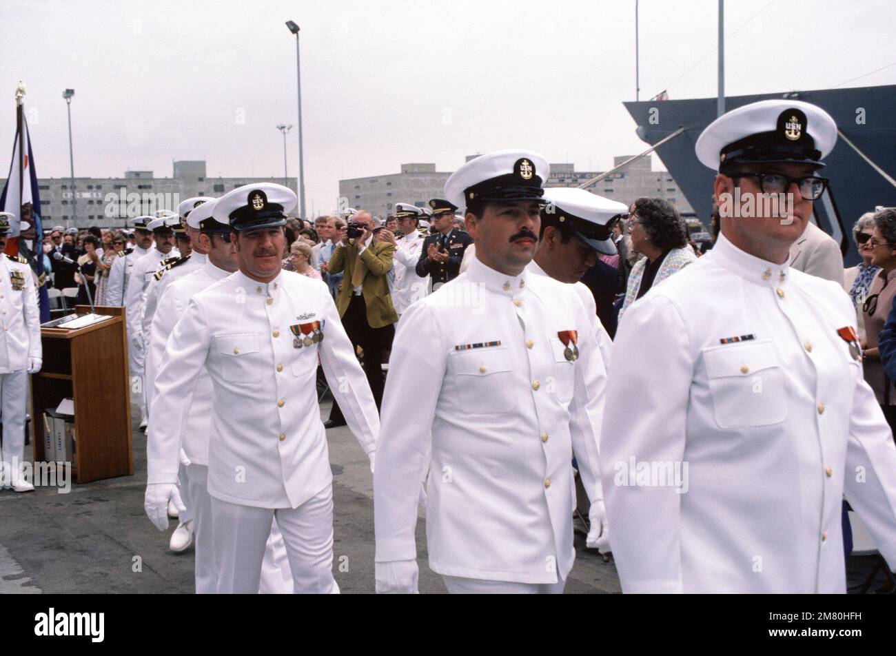 Crewmen and officers prepare to board the guided missile frigate USS ...