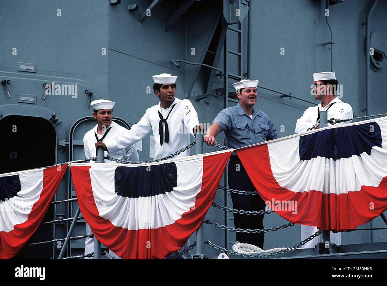 Crewmen stand on the deck of the guided missile frigate USS JARRETT ...