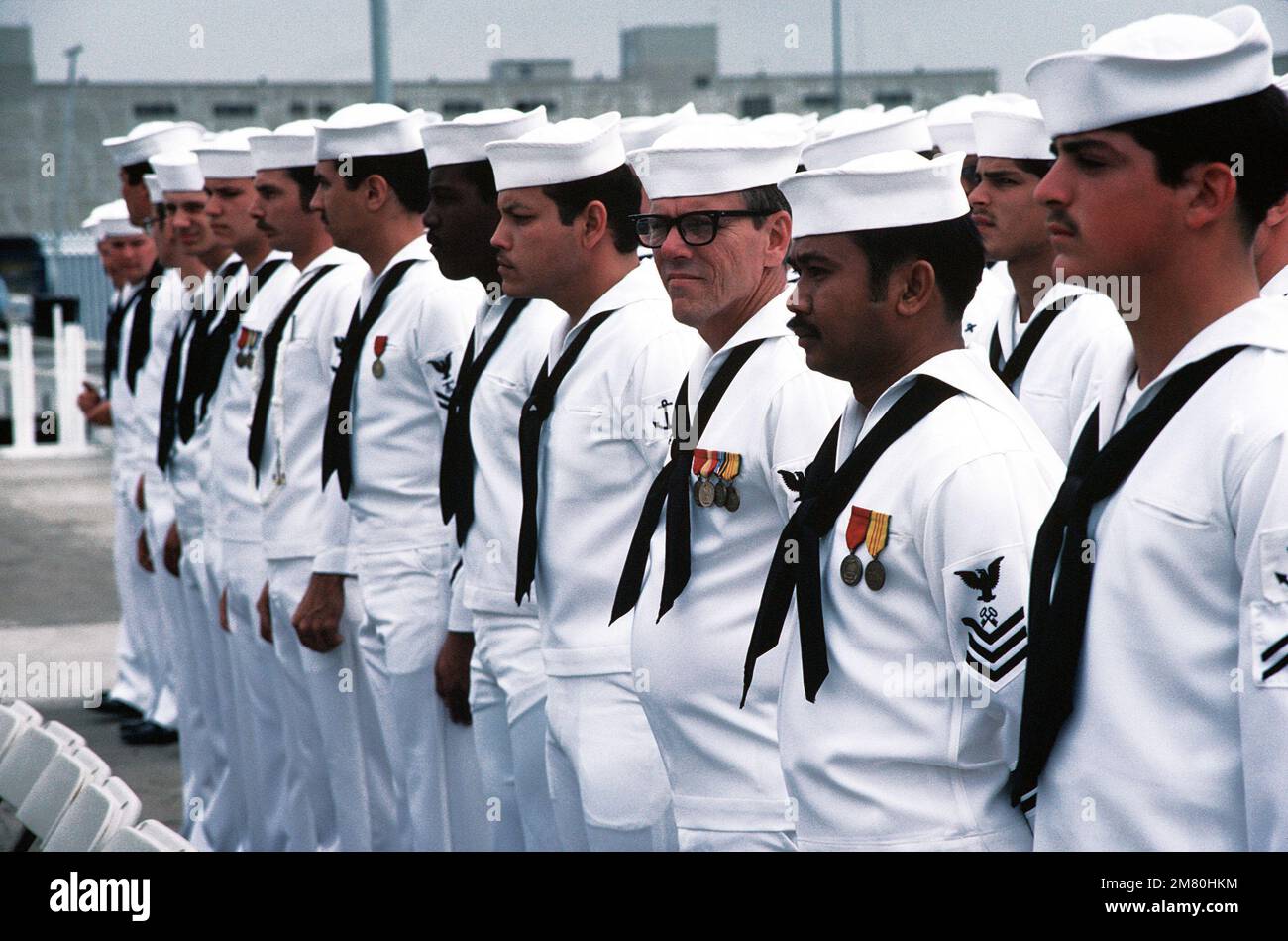 Crewmen line the rail of the guided missile frigate USS JARRETT (FFG 33 ...