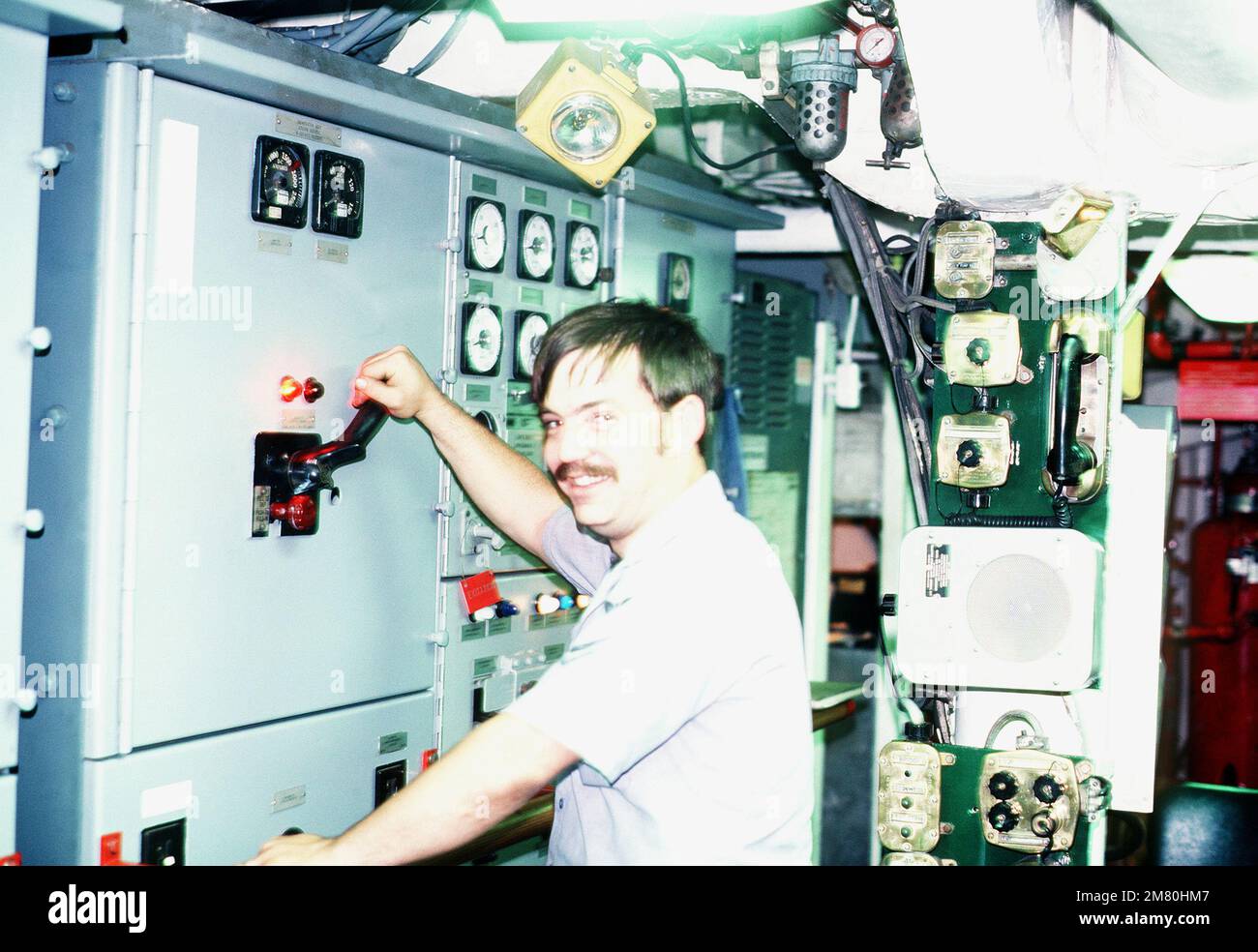 Machinist Mate 2nd Class Mike McPherson operates the propulsion ...