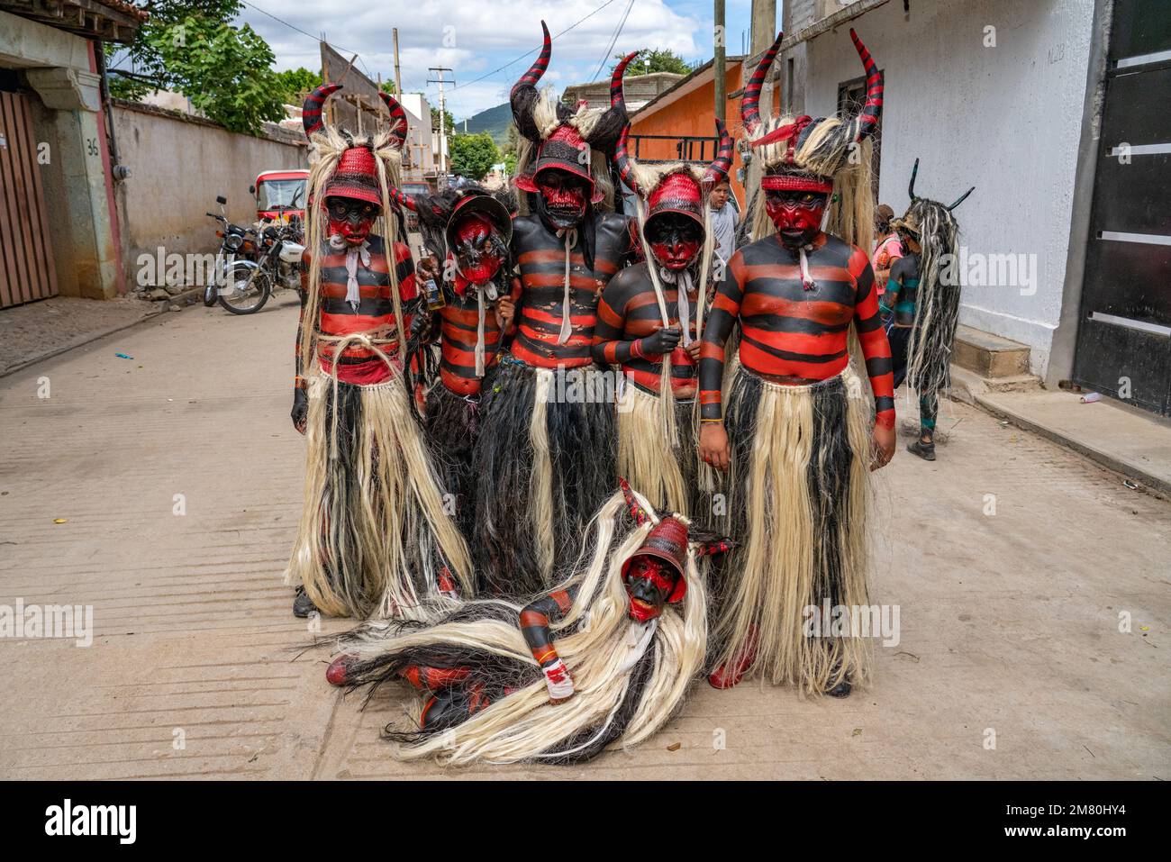 Celebrants in cachudo costumes with masks & horns at the Fiesta of ...
