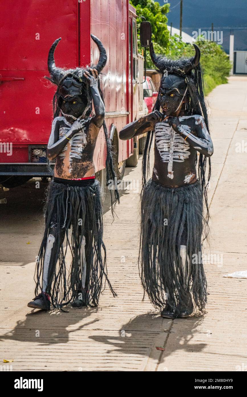 Young boys in cachudo costumes with masks & horns at the Fiesta of ...