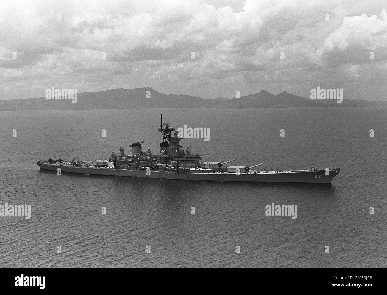 Aerial starboard view of the battleship USS NEW JERSEY (BB-62) underway ...