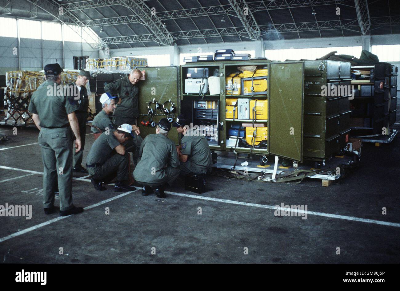 Air National Guard personnel conduct an inventory of equipment inside ...
