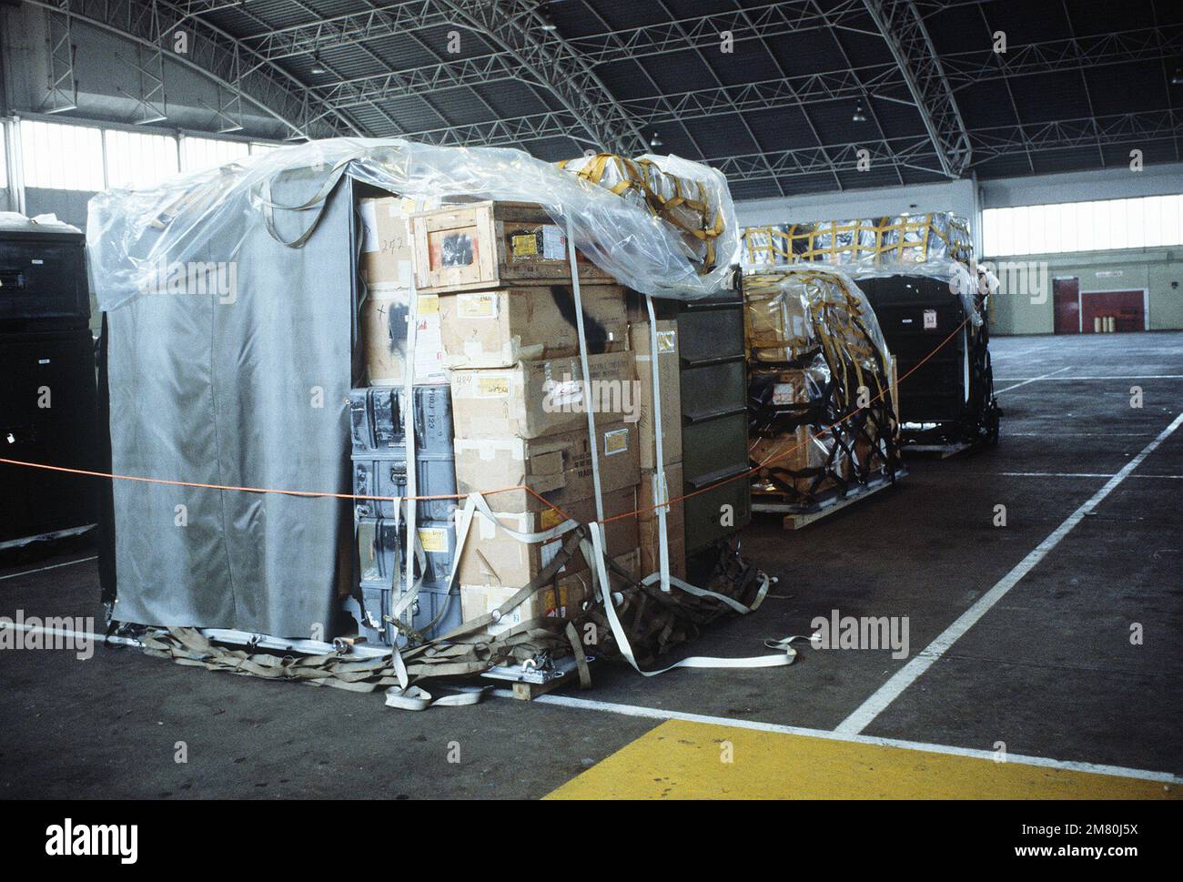 Equipment and supplies are stored in the maintenance hangar for ...