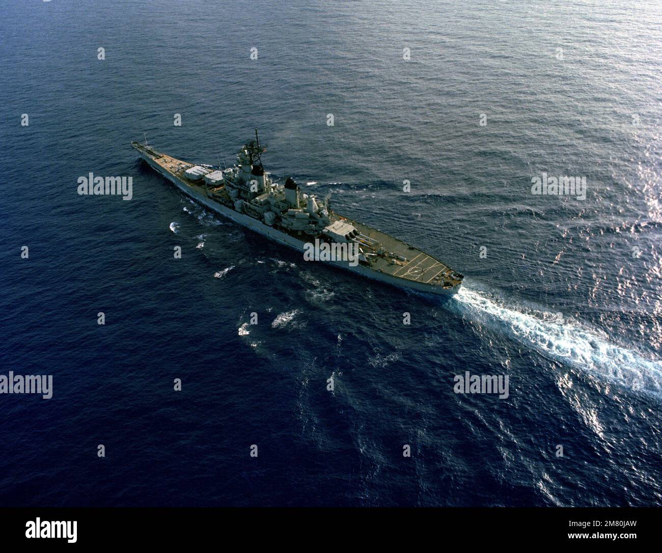 A port quarter view of the battleship USS NEW JERSEY (BB-62) underway ...