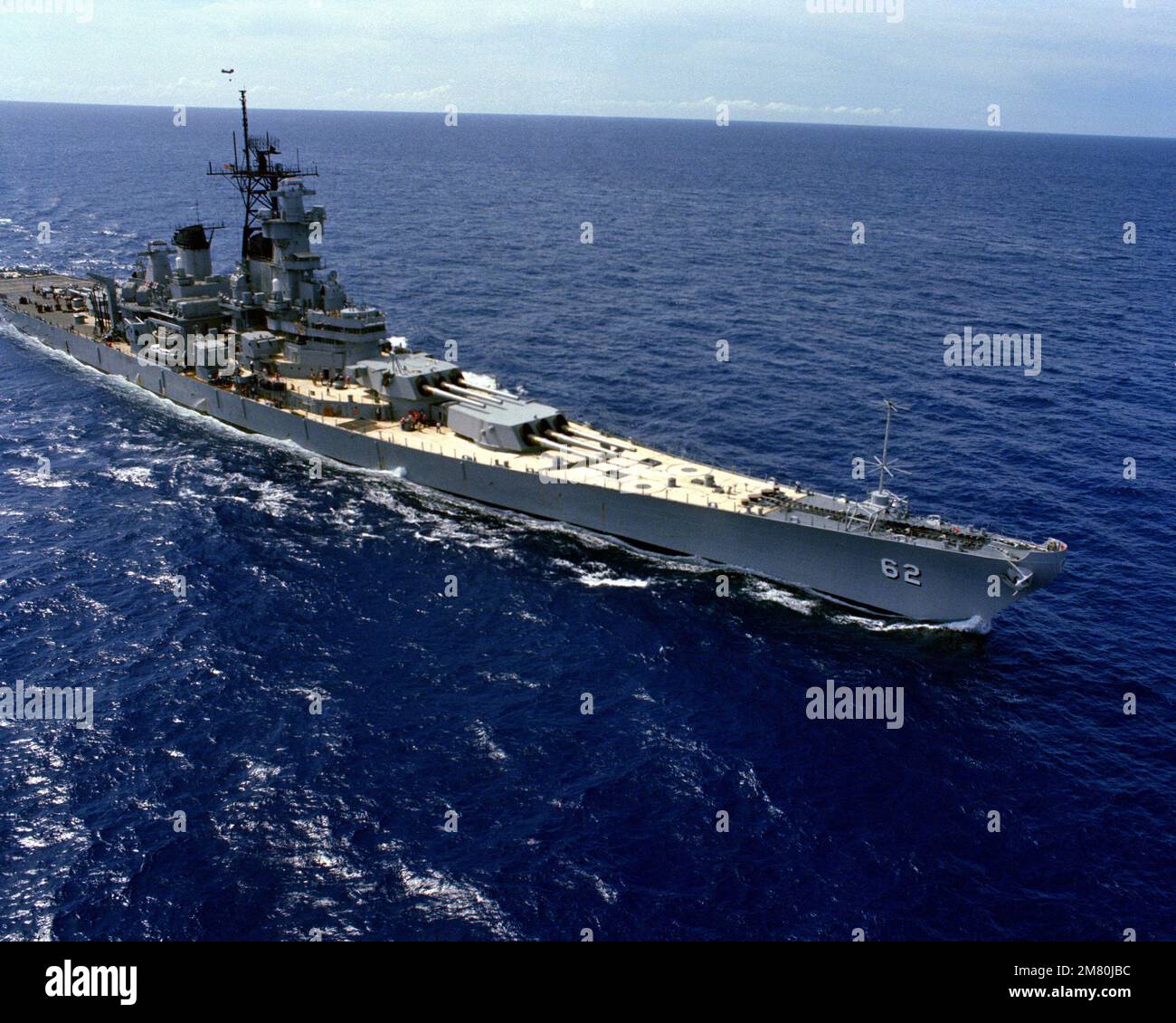 A starboard bow view of the battleship USS NEW JERSEY (BB-62) underway ...