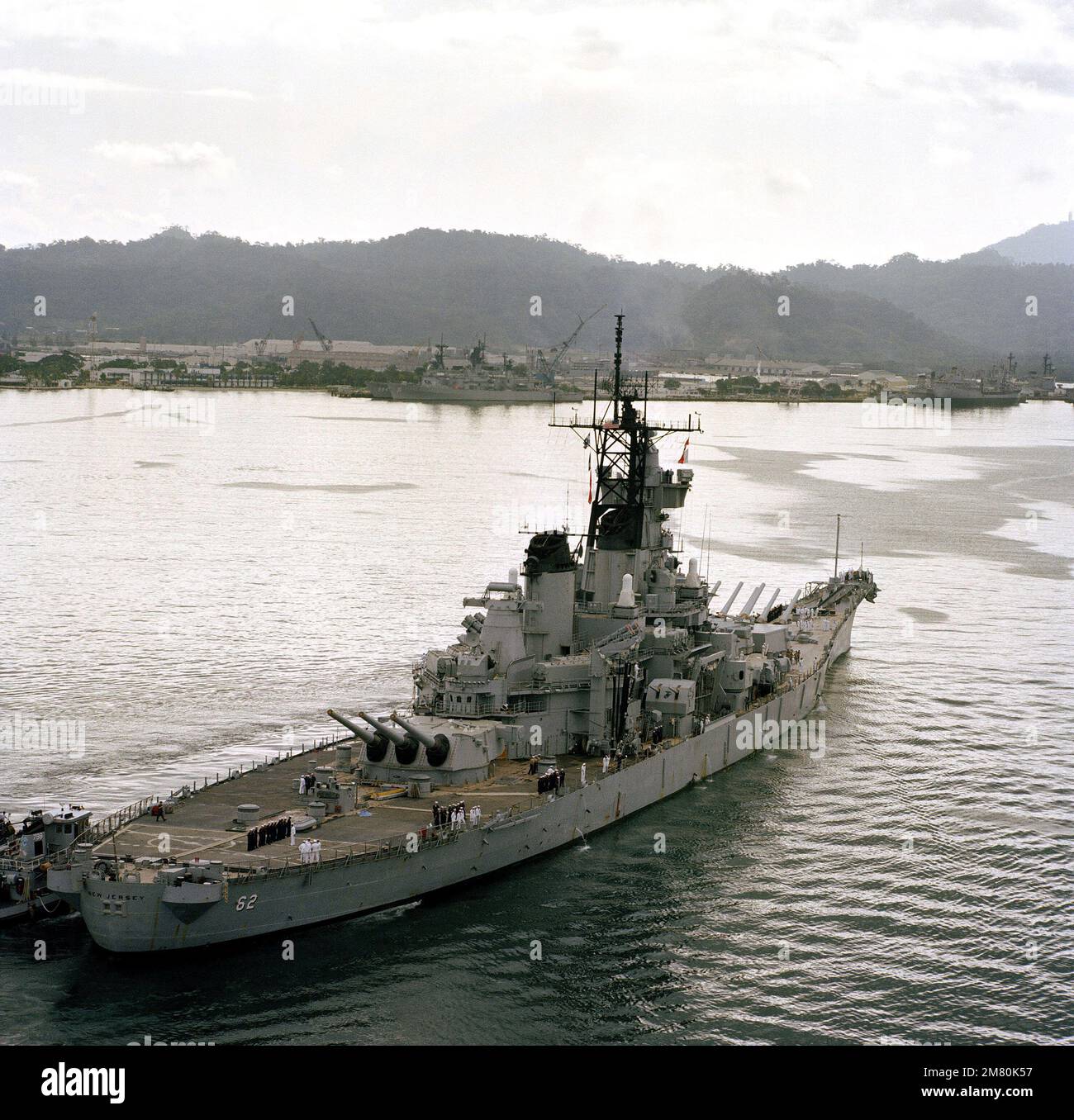 An aerial starboard quarter view of the battleship USS NEW JERSEY (BB ...