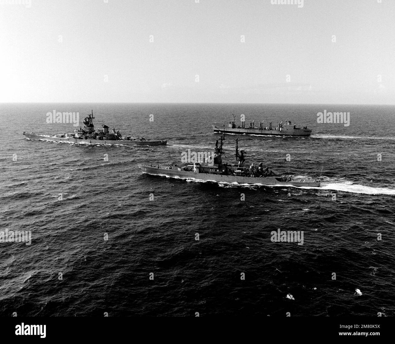 A port beam view of three ships from the New Jersey Task Group underway ...