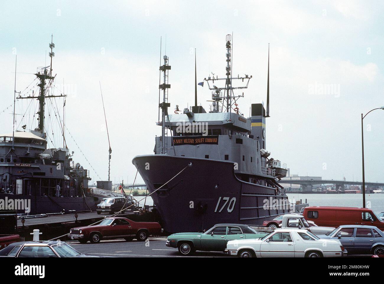 A port bow view of the fleet tug USNS MOHAWK (T-ATF-170) and the ocean ...