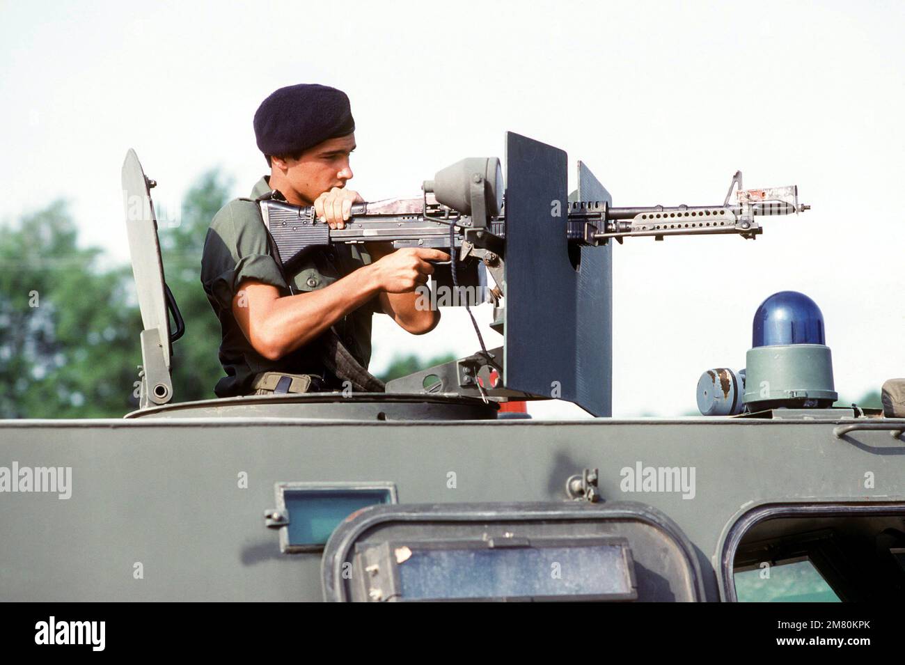 A member of the 90th Security Police Group aims a 7.62 mm M60 machine ...