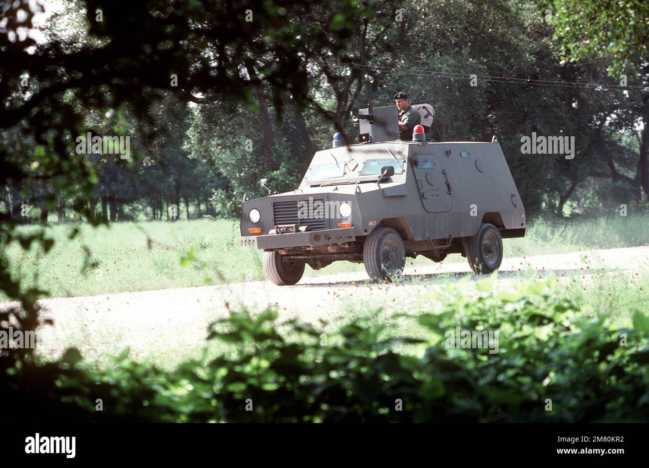 Members of the 90th Security Police Group patrol the base in a Cadillac ...