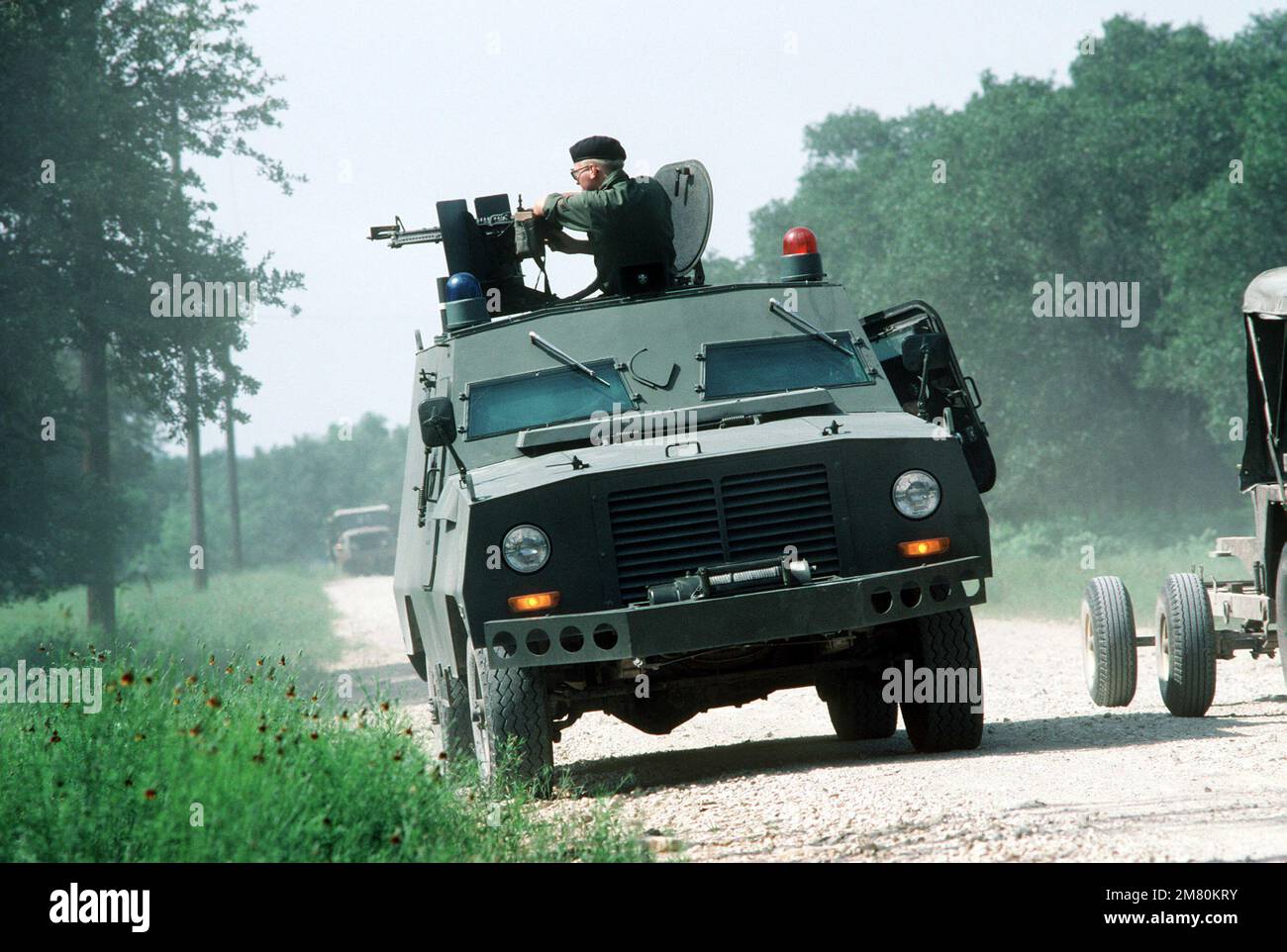 Members of the 90th Security Police Group patrol the base in a Cadillac ...