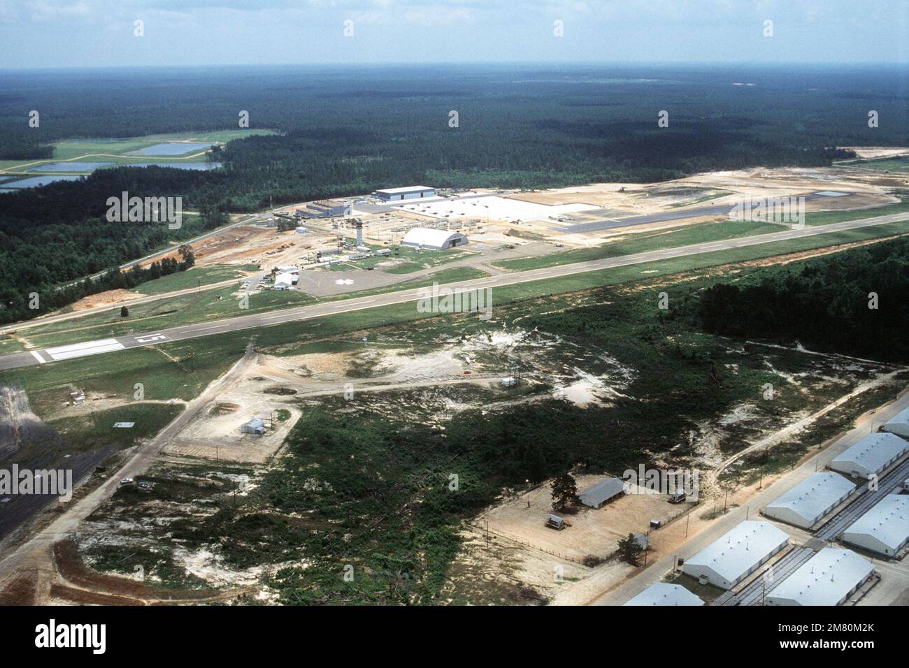 An aerial view of the new hangar and maintenance buildings. Base: Fort ...