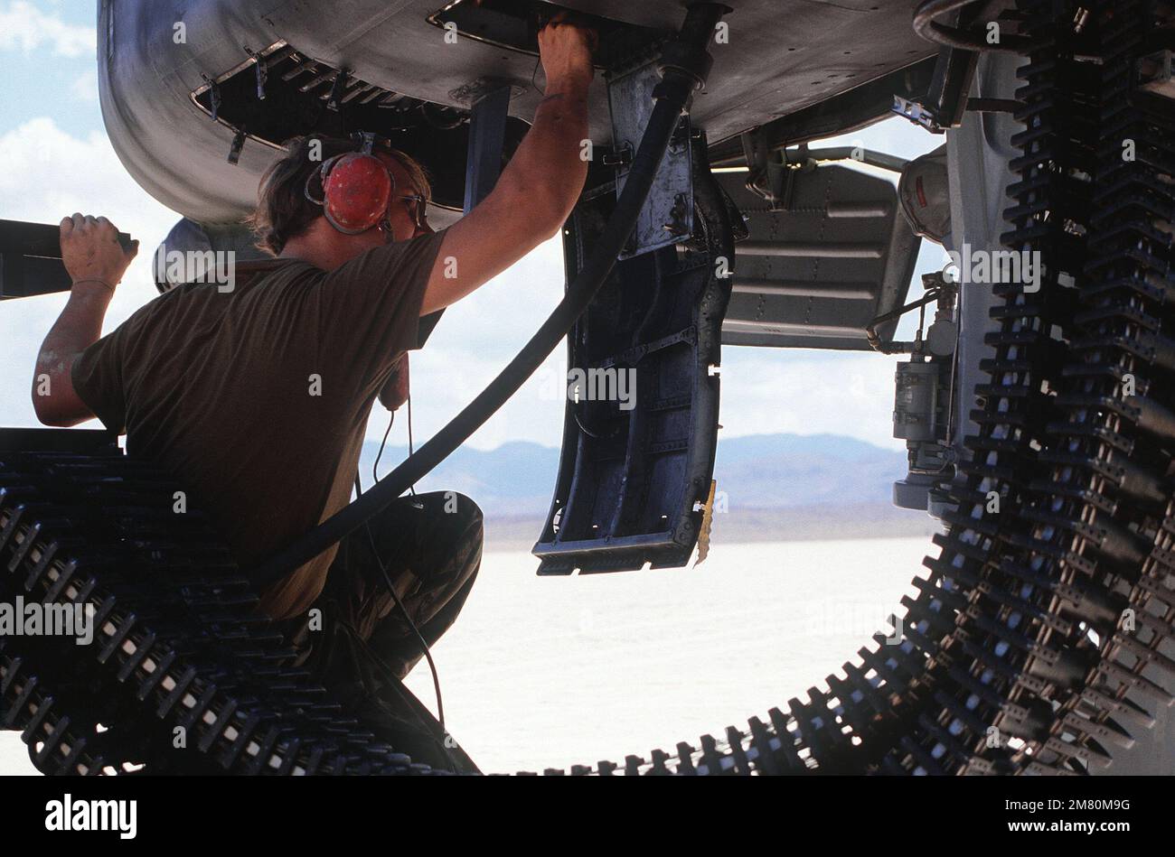 A 30 mm cannon loader is used to rearm the 30 mm cannon on an A-10 ...