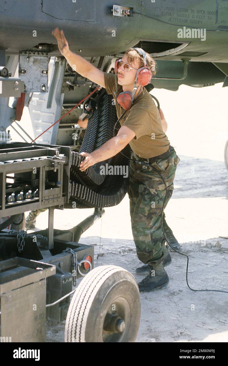 A 30 mm cannon loader is used to rearm the 30 mm cannon on an A-10 ...