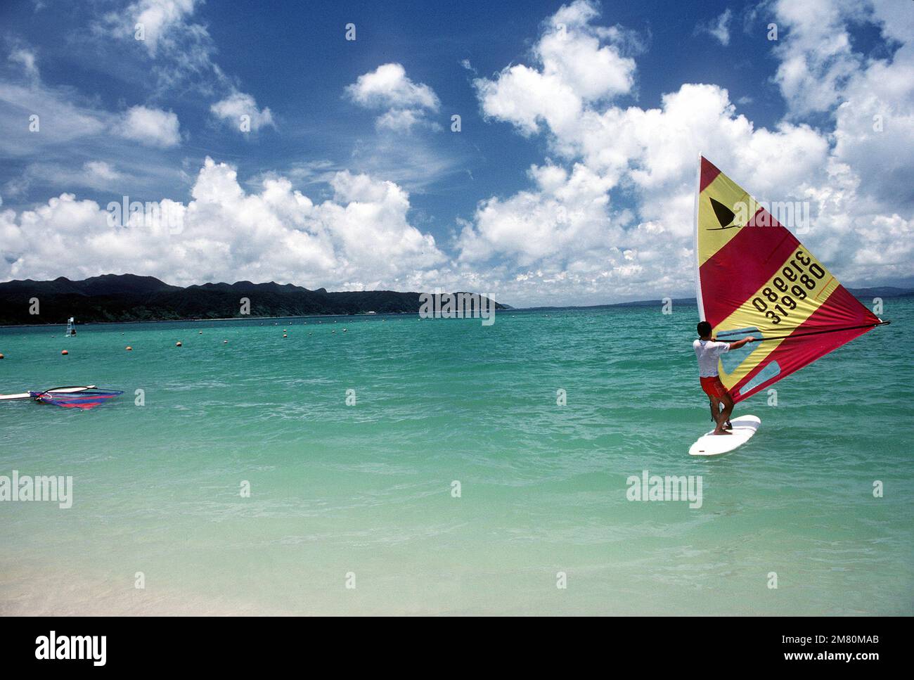 An airman windsurfs at the Okuna Recreation Area north of Kadena Air ...