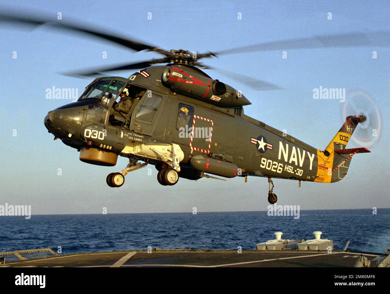 A left front view of a Helicopter Light Anti-submarine Squadron 30 (HSL ...