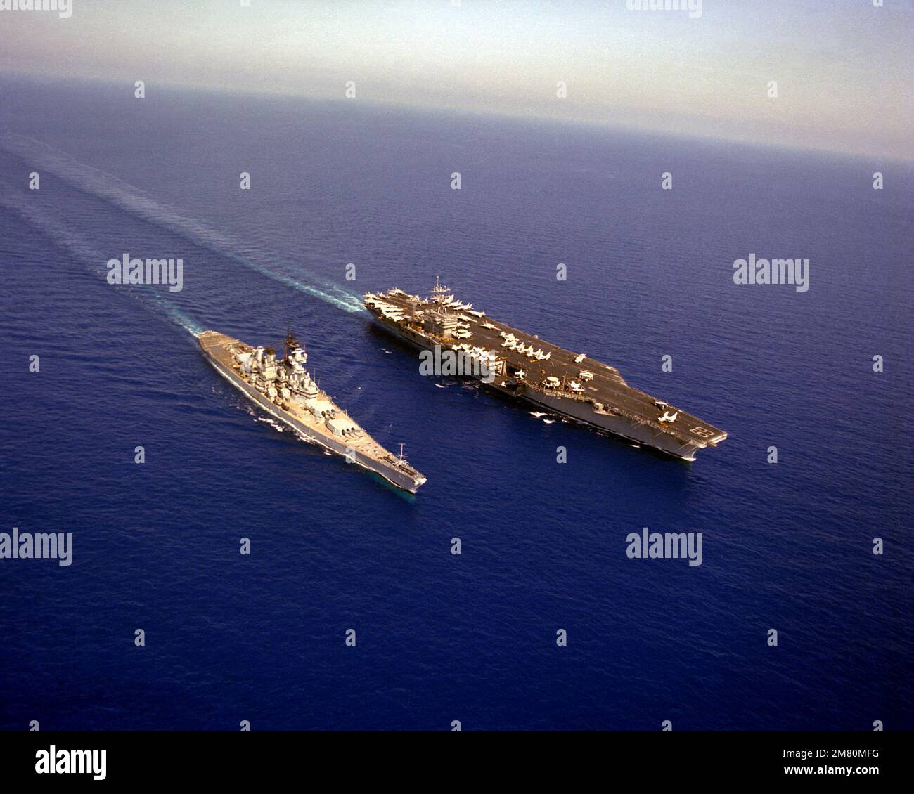 An aerial starboard bow view of the nuclear-powered aircraft carrier ...