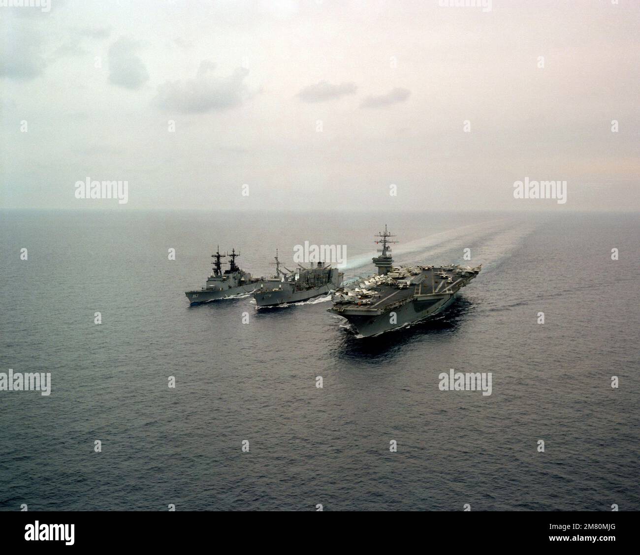 An aerial port bow view of the nuclear-powered aircraft carrier USS ...