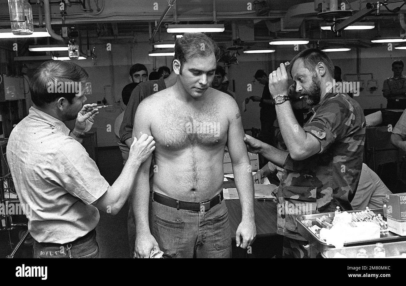 Hospital corpsmen 2nd class (HM2) Dennis Boyles (left) and William ...