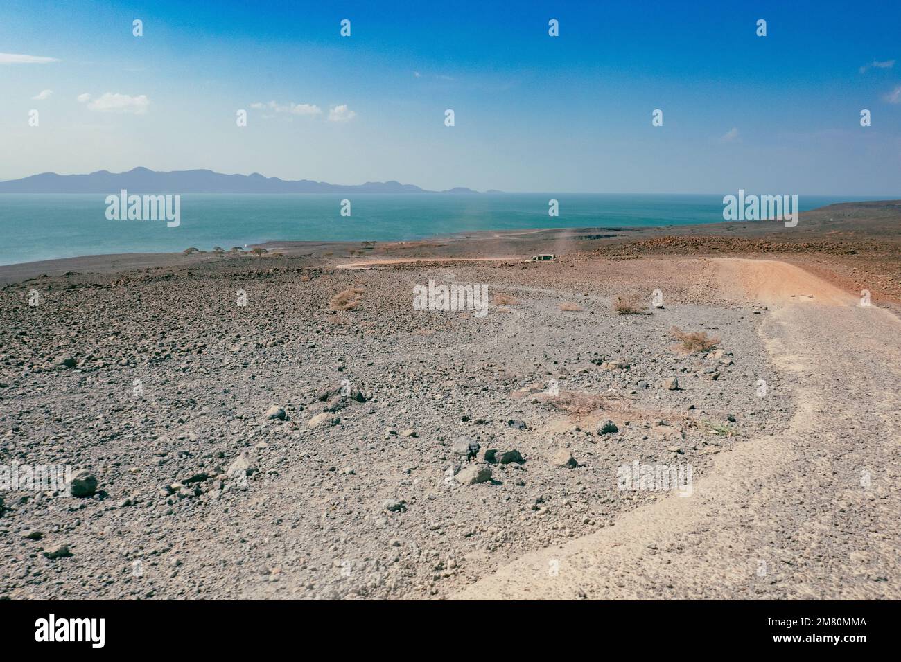 A safari vehicle in the desert landscapes of Turkana County, Kenya ...