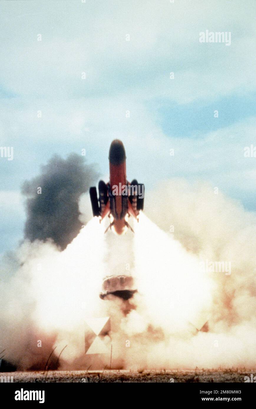 An Otomat anti-ship missile is fired from a ship-mounted launcher. This ...