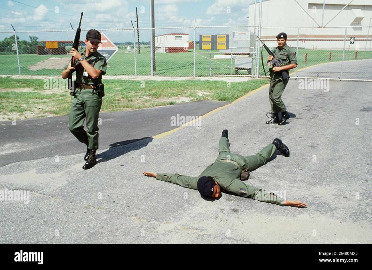 SENIOR AIRMAN Robert T. Ontiveros, a security policeman, approaches to ...