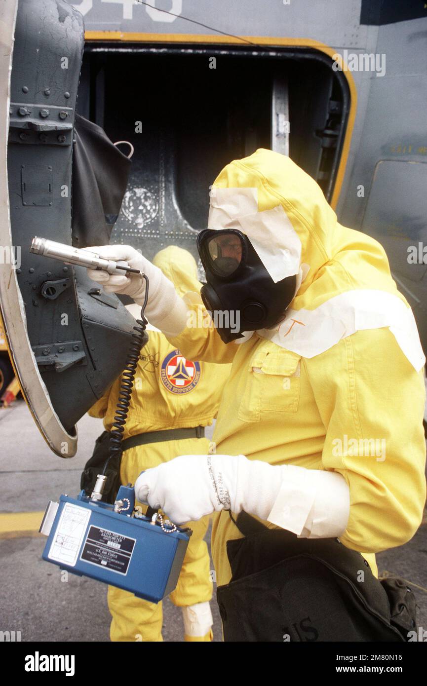 A member of the Strategic Air Command Disaster Response Force checks an ...