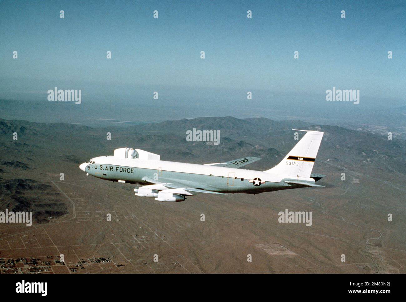 An air-to-air left side view of an NKC-135 Airborne Laser Laboratory ...