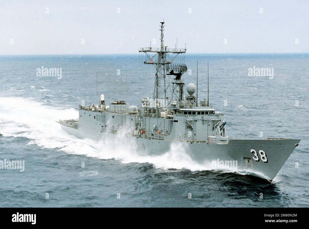 An aerial starboard bow view of the guided missile frigate USS CURTS ...