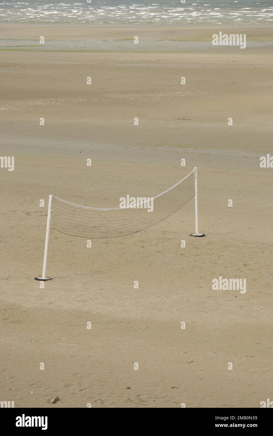 Tensioned volleyball net on an empty beach in Brittany Stock Photo - Alamy