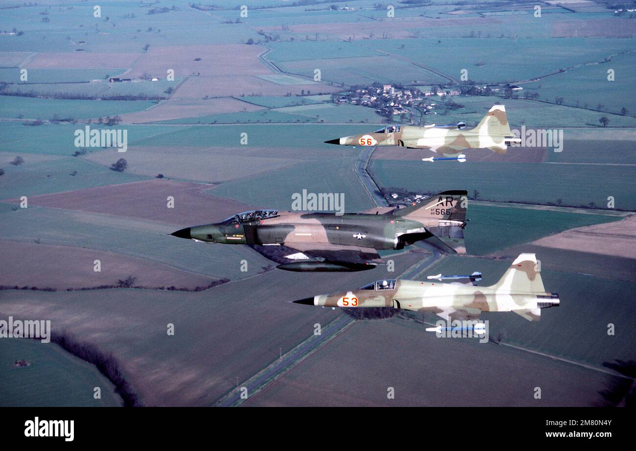 An air-to-air left side view of an RF-4 Phantom II aircraft flown by ...