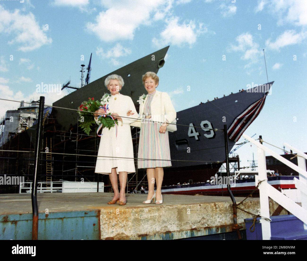Edna D. Woodruff, left, sponsor of the guded missile frigate ROBERT G ...