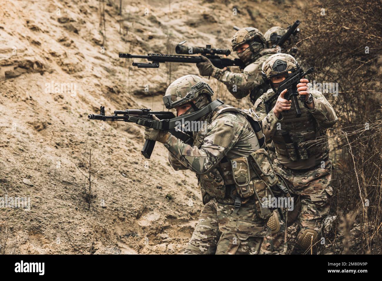 Group of soldiers with rifles before combat Stock Photo - Alamy