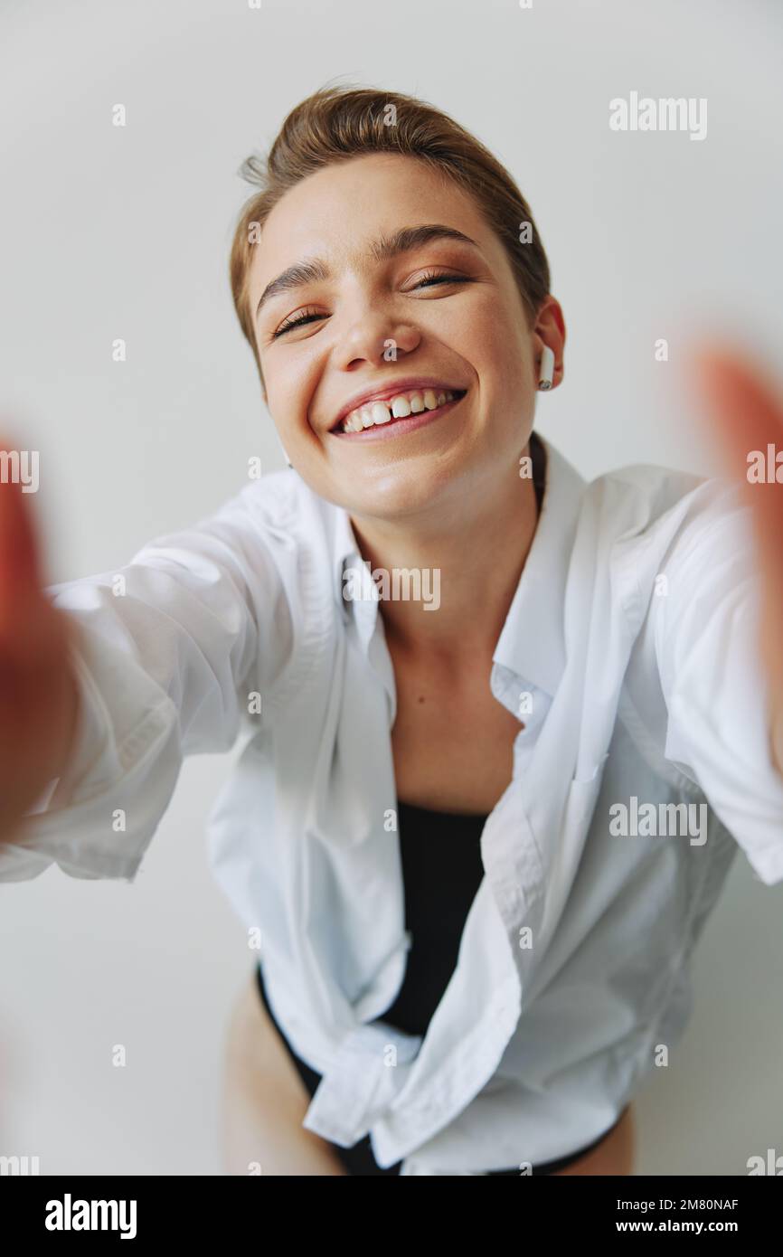 Young woman teenager listening to music with infertile headphones and ...
