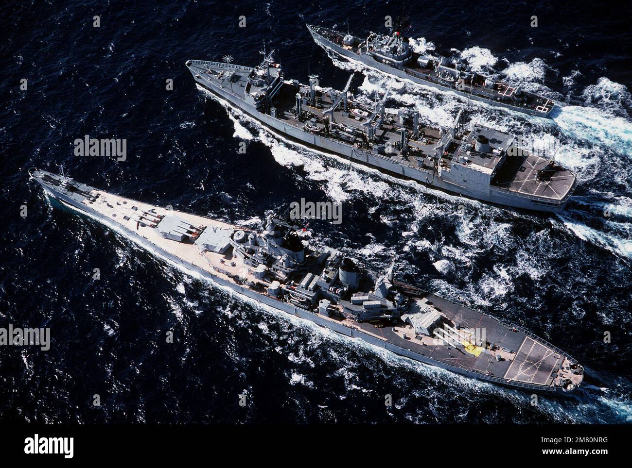 A port view of the replenishment oiler USS KANSAS CITY (AOR-3), center ...