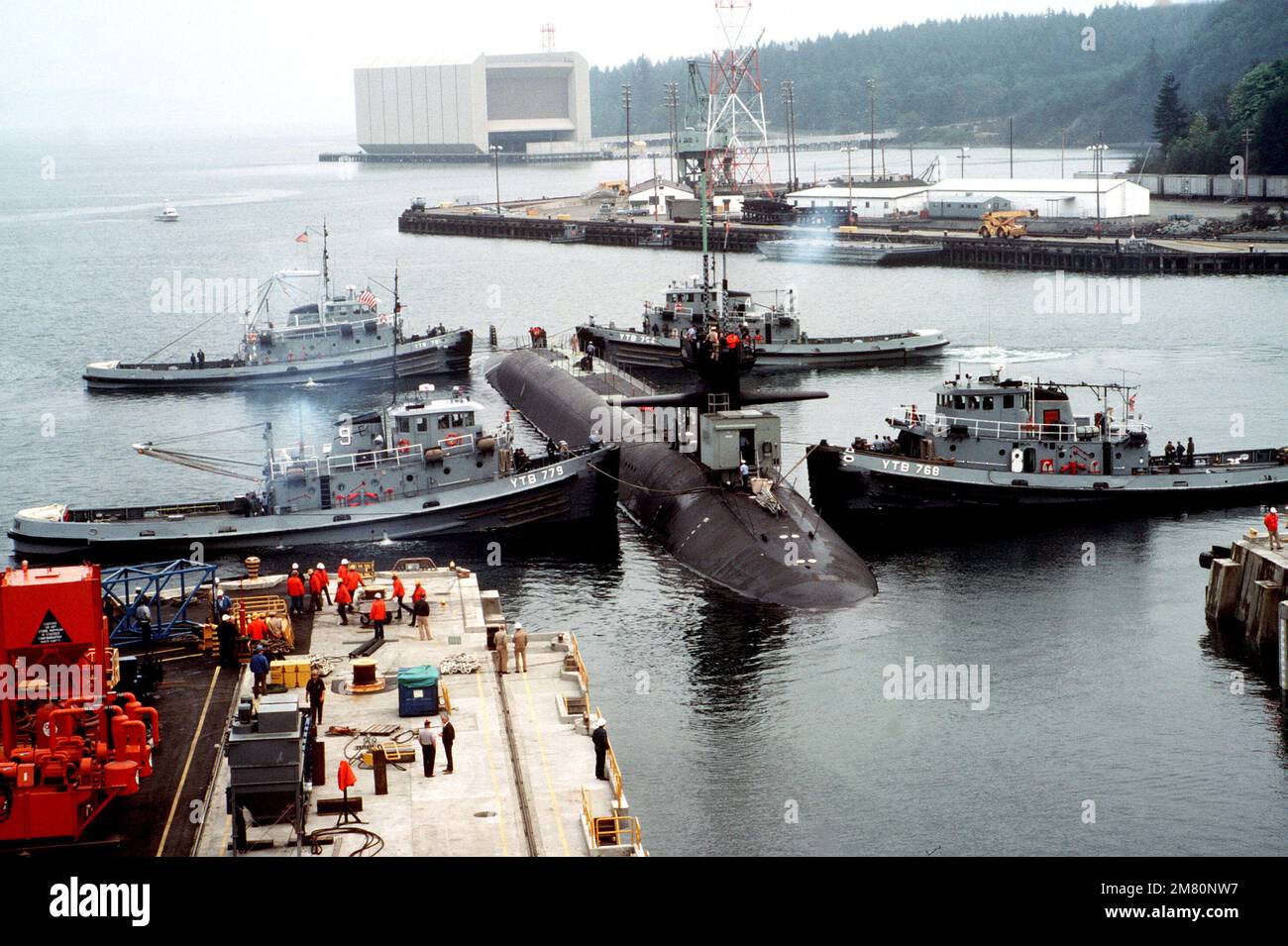 YTB 760-class harbor tugs guide the nuclear-powered strategic missile ...