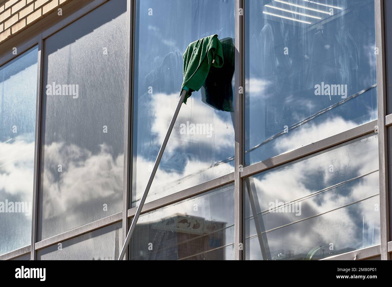 window washing, washing a street shop window Stock Photo - Alamy