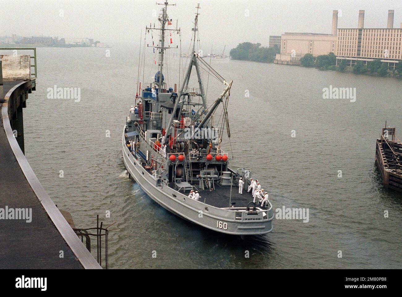A port quarter view of the fleet tug USS PAPAGO (ATF-160) passing ...