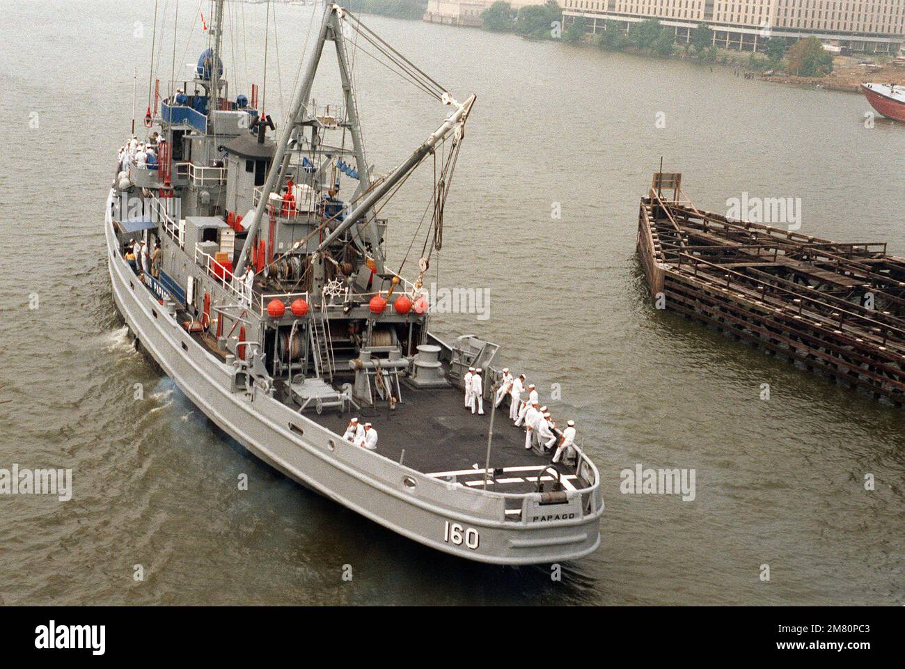 A port quarter view of the fleet tug USS PAPAGO (ATF-160) passing ...