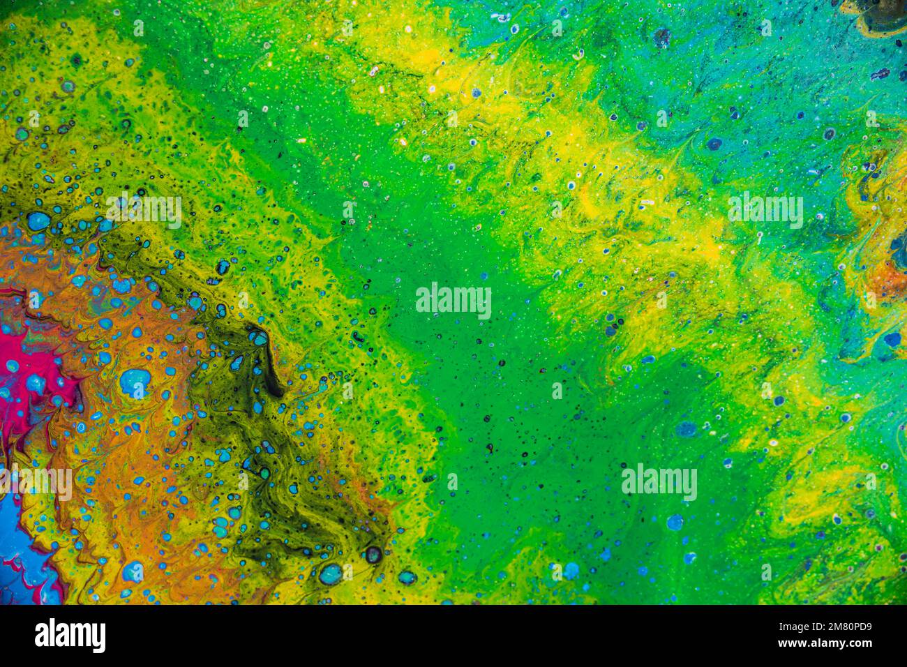 Mixture of liquid acrylic colors creating a marbled texture of bright ...