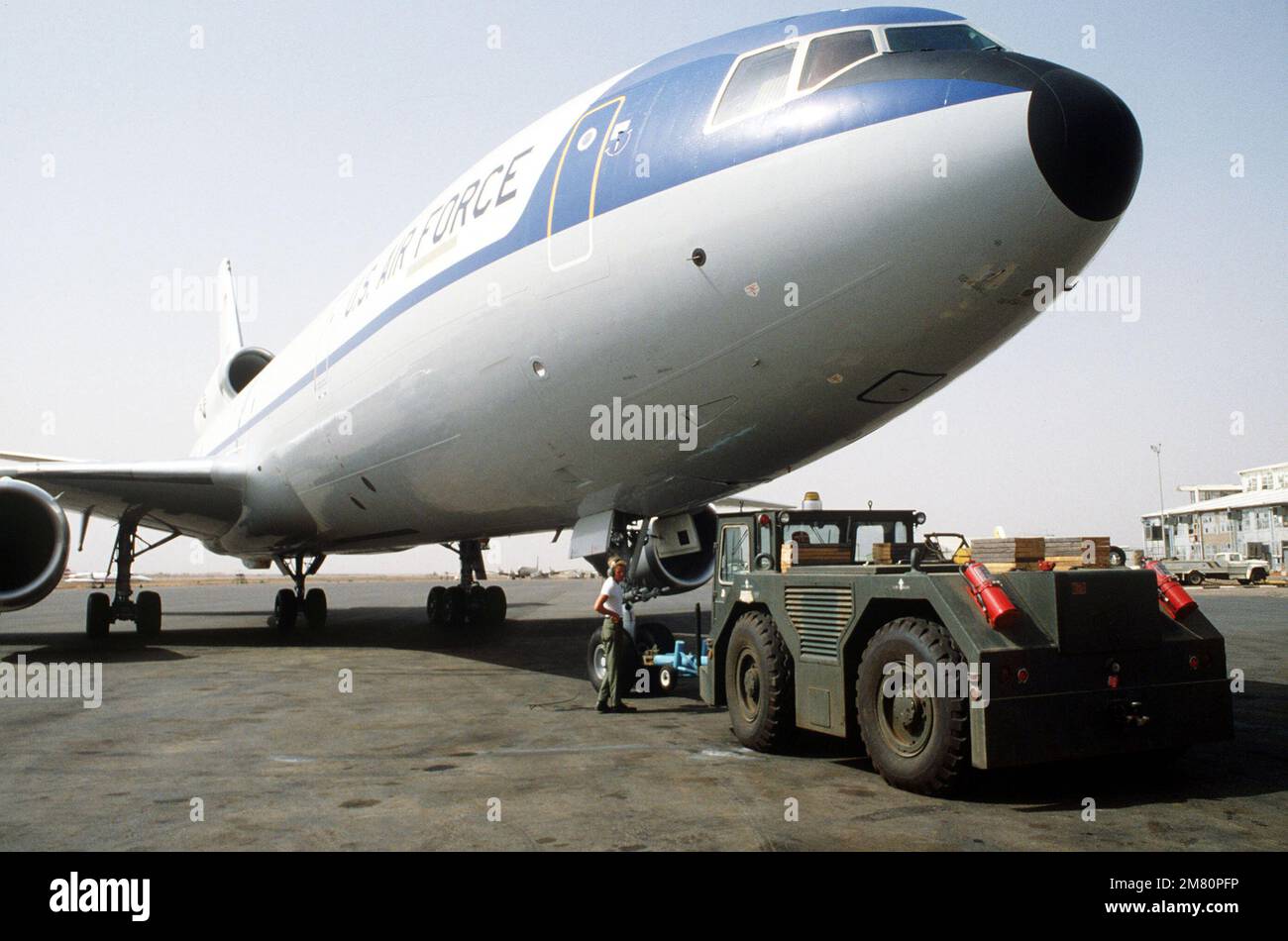 A right front view of a KC-10 Extender aircraft being moved to a ...